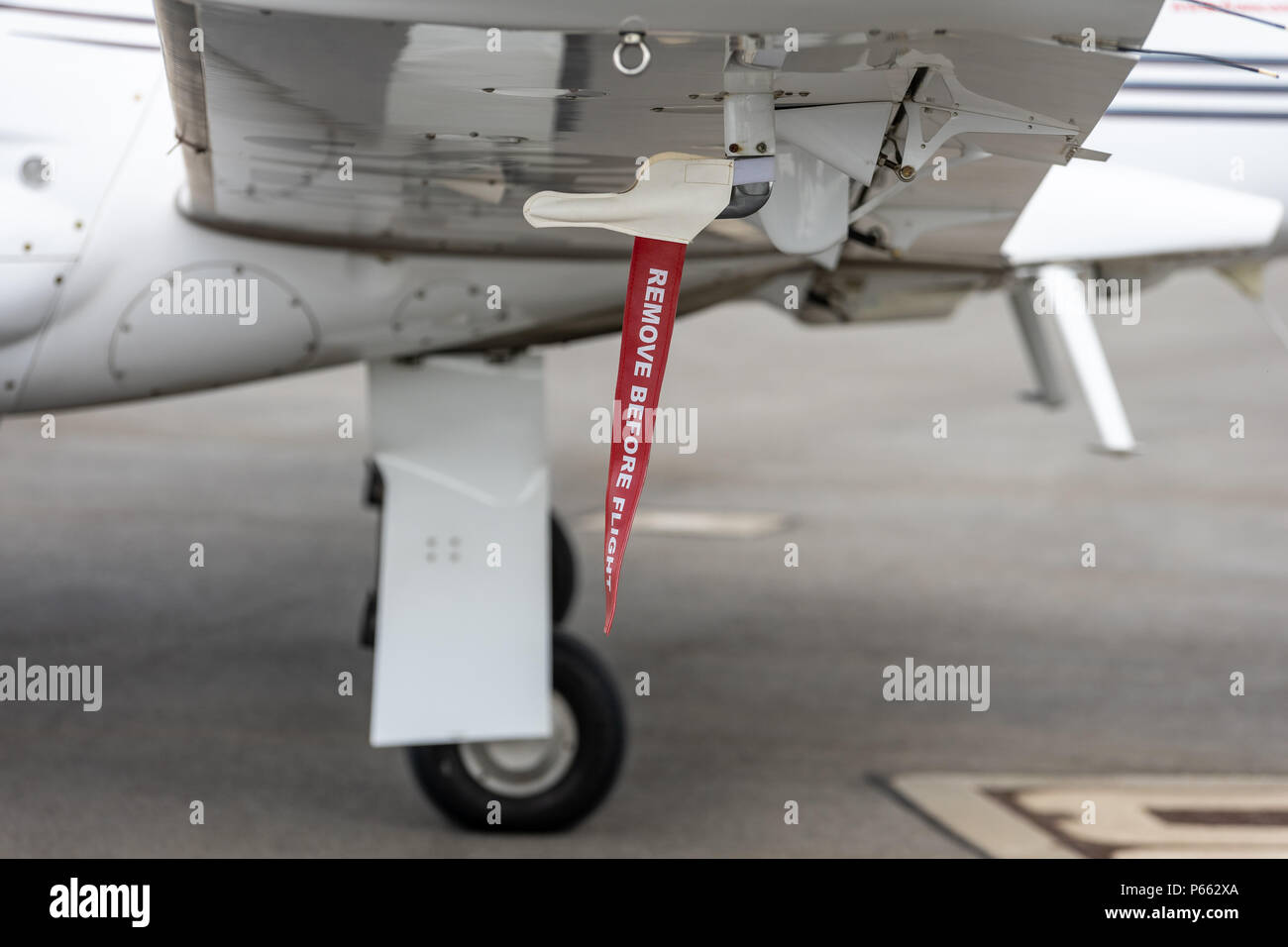 A remove before flight ribbon on еthe airplane. Close-up Stock Photo ...