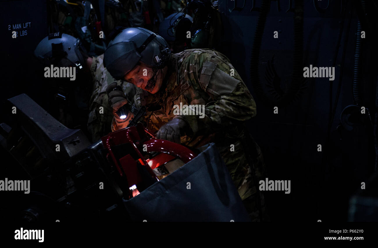 An aerial gunner with the 4th Special Operations Squadron inspects ...