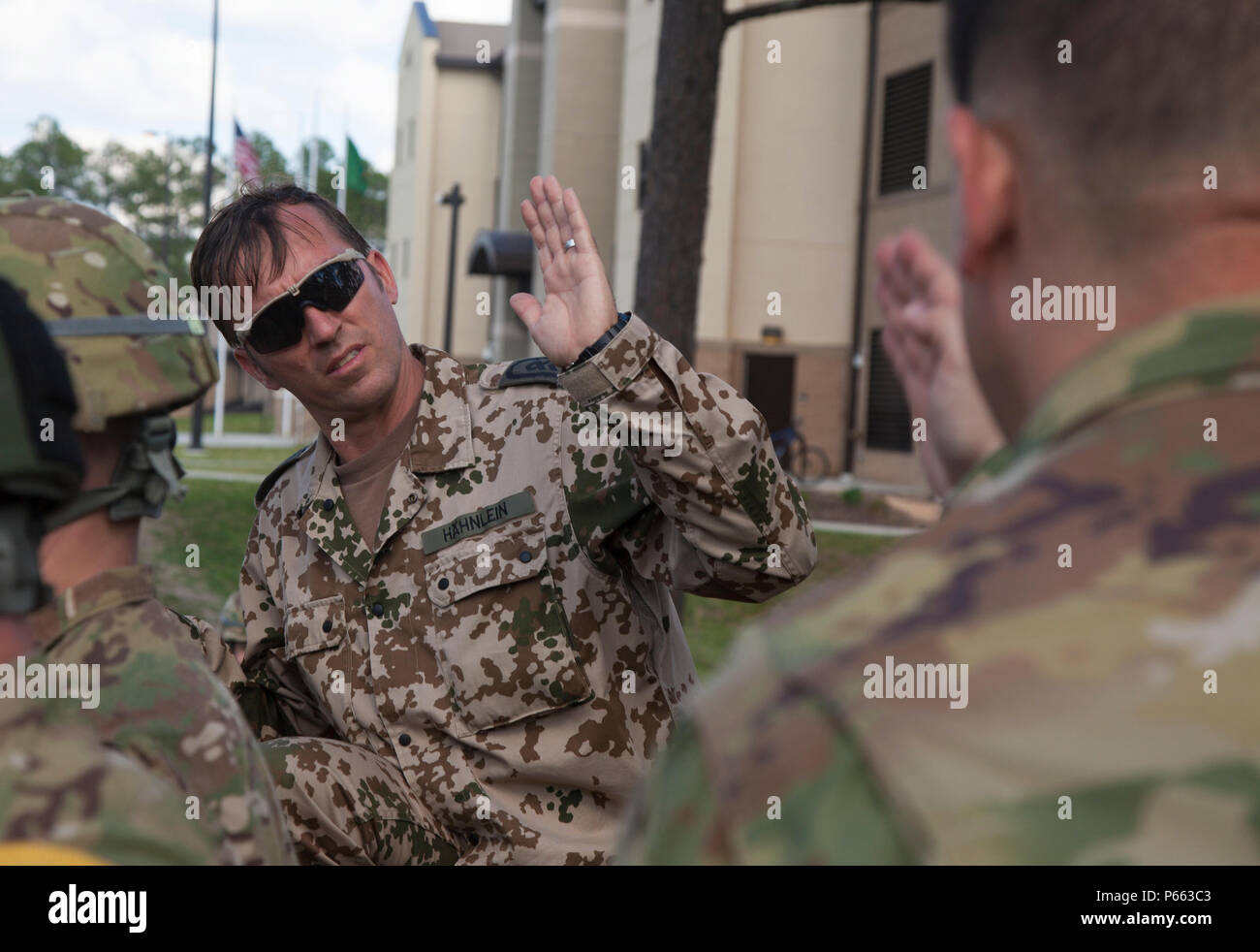 German airborne jumpmaster, Sgt. Maj. Hahnlein, conducts pre-jump ...