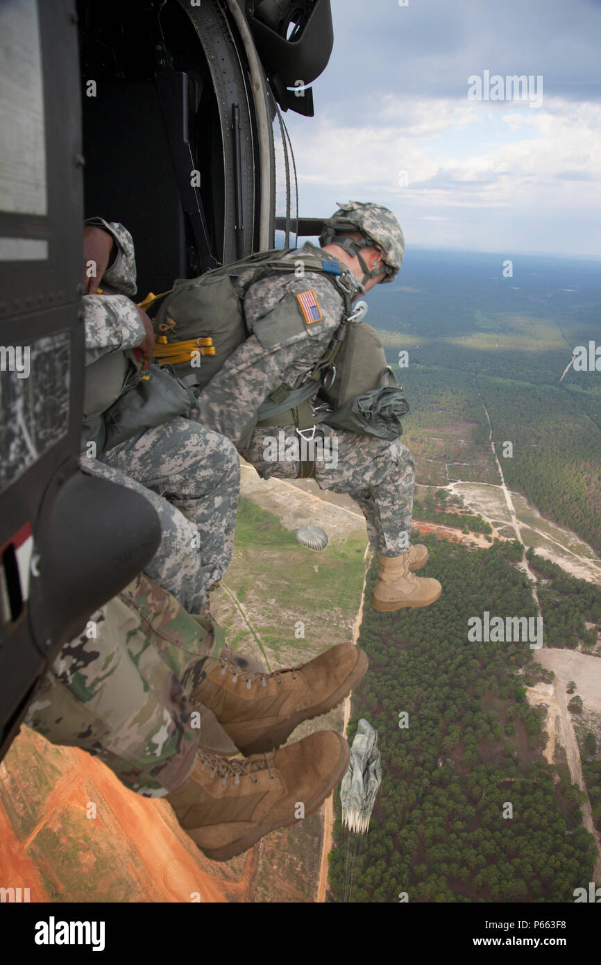 A U.S. Army Paratrooper jumps from a UH-60 Blackhawk over the St. Mere ...