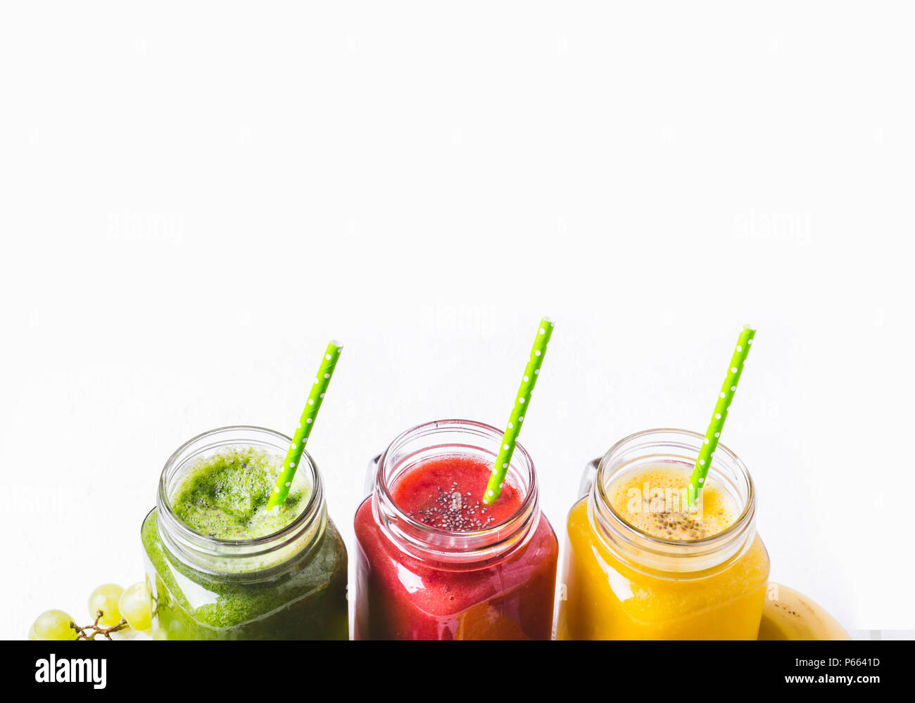 Selection of multicolored fruit smoothies in glass jars. Healthy Food ...