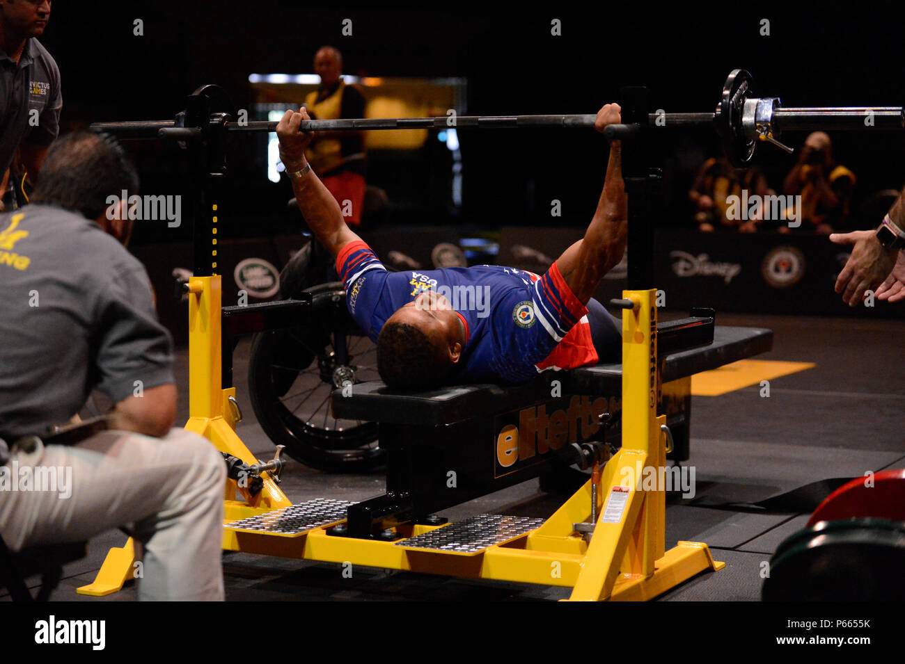 U.S. Army Sgt. Ryan Major, veteran, bench presses during the ...