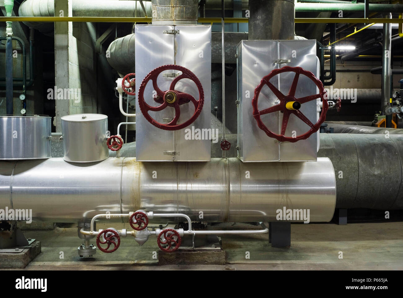 Control wheels and pipes at sugar factory, Picardie, France Stock Photo ...