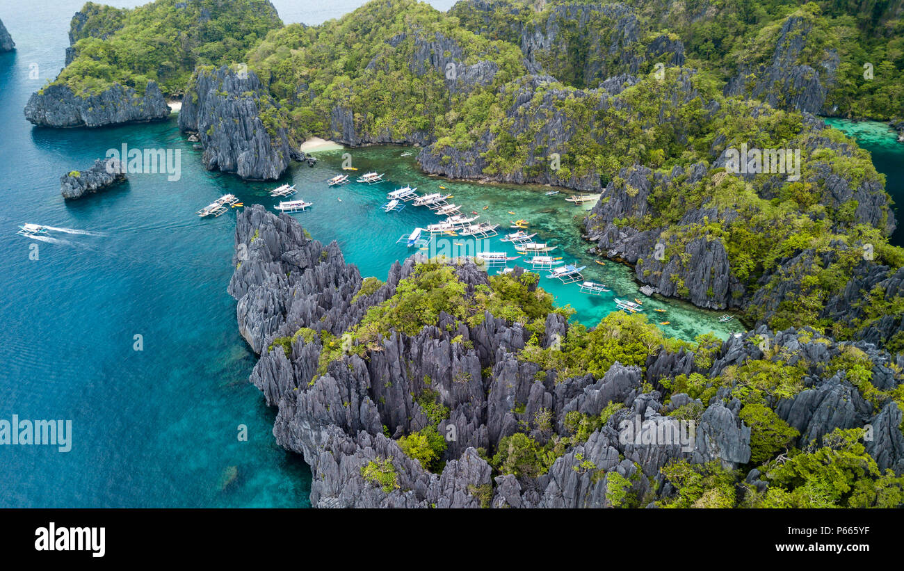 Aerial view of traditional Banca boats inside a spectacular shallow ...