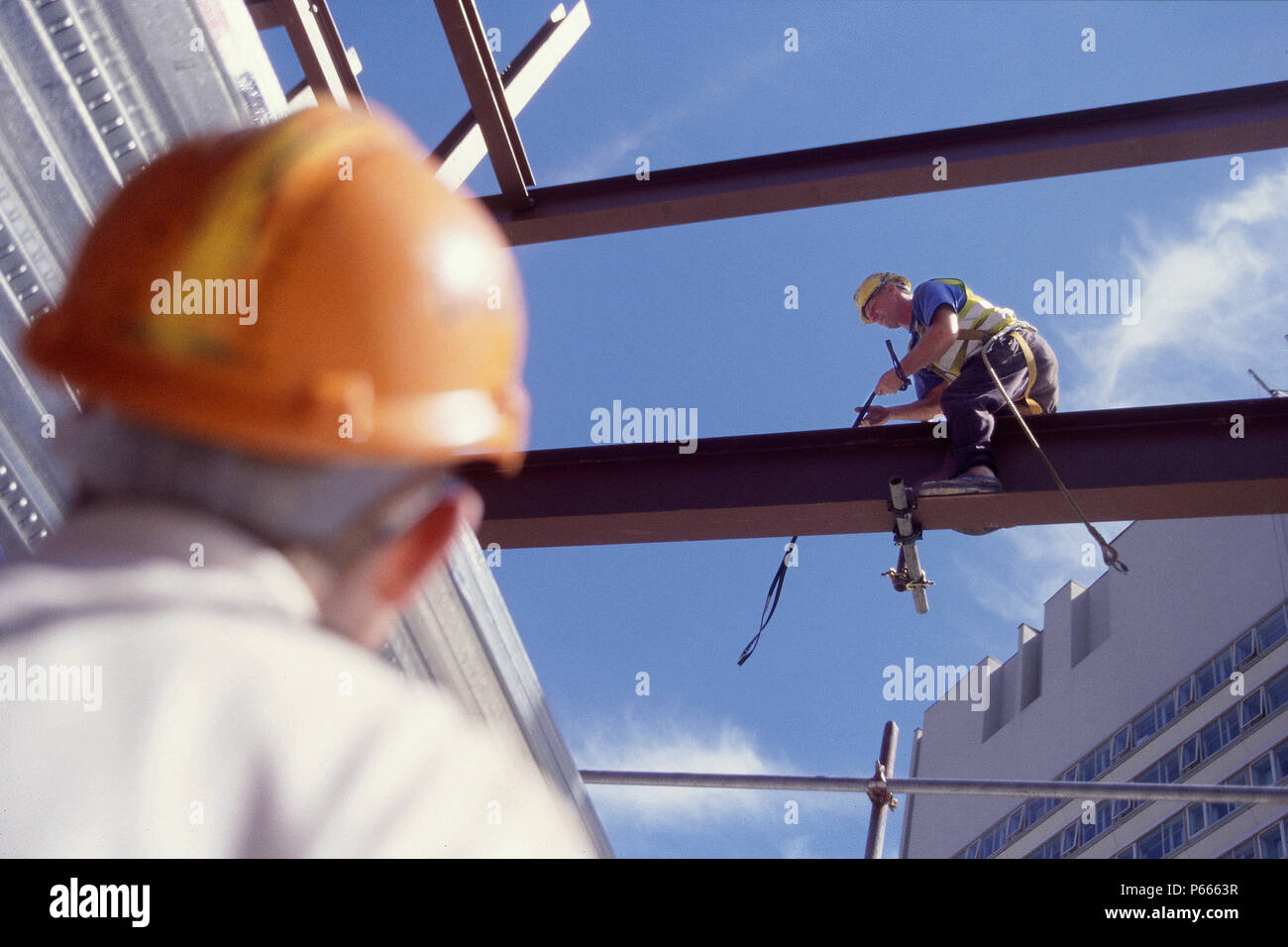 Men working at heights Stock Photo - Alamy