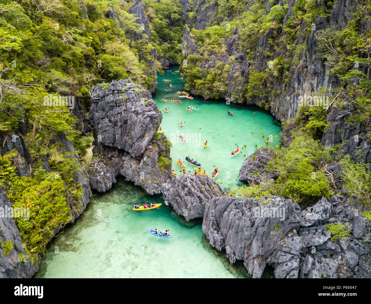 Aerial drone view of kayaks inside a beautiful shallow tropical lagoon ...