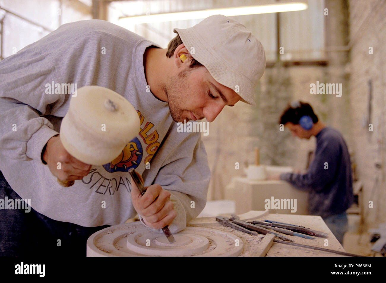 Stonemason making decorative stone block Stock Photo - Alamy