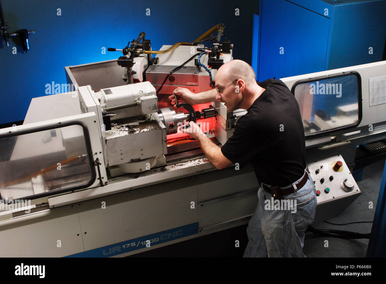 Man using lathe Stock Photo - Alamy