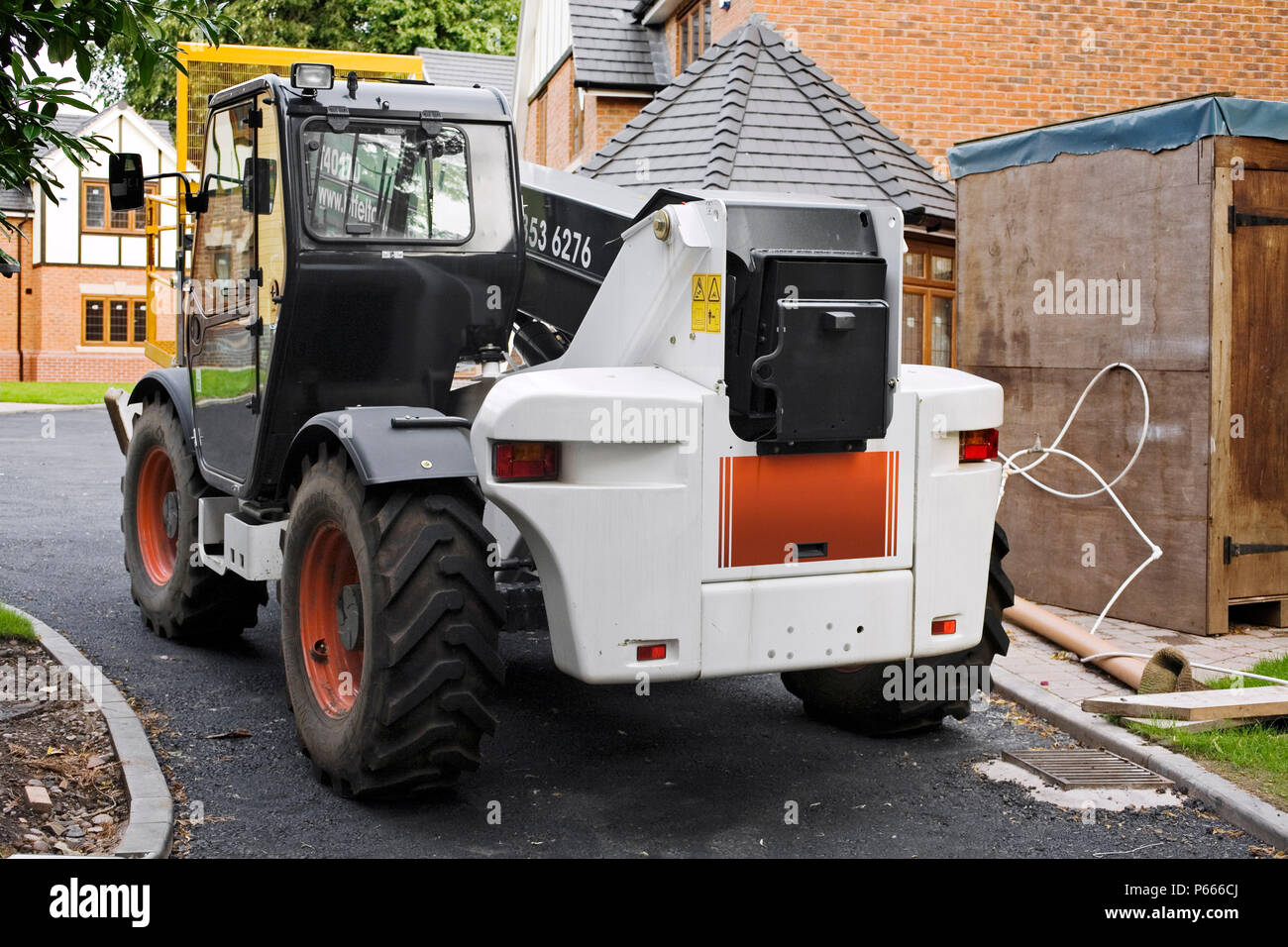 Bobcat on residential building site in Four Oaks, West Midlands, UK ...