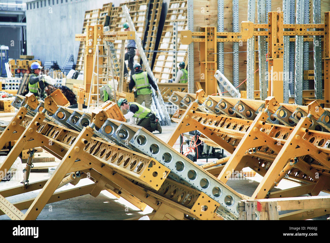 Workers assemble concrete form sections on Tower One site, Lower ...