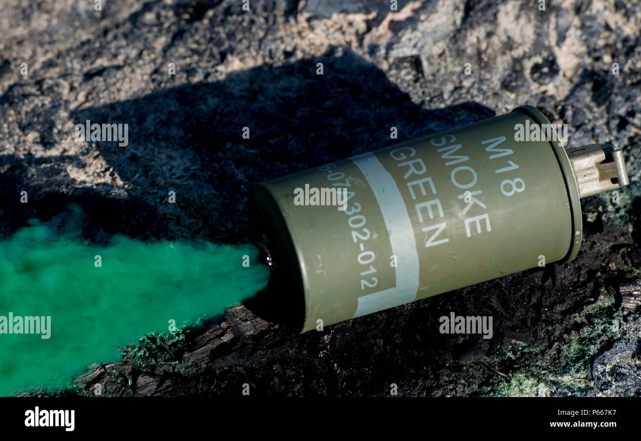 An M-18 smoke grenade marks the landing zone for 24th Special ...