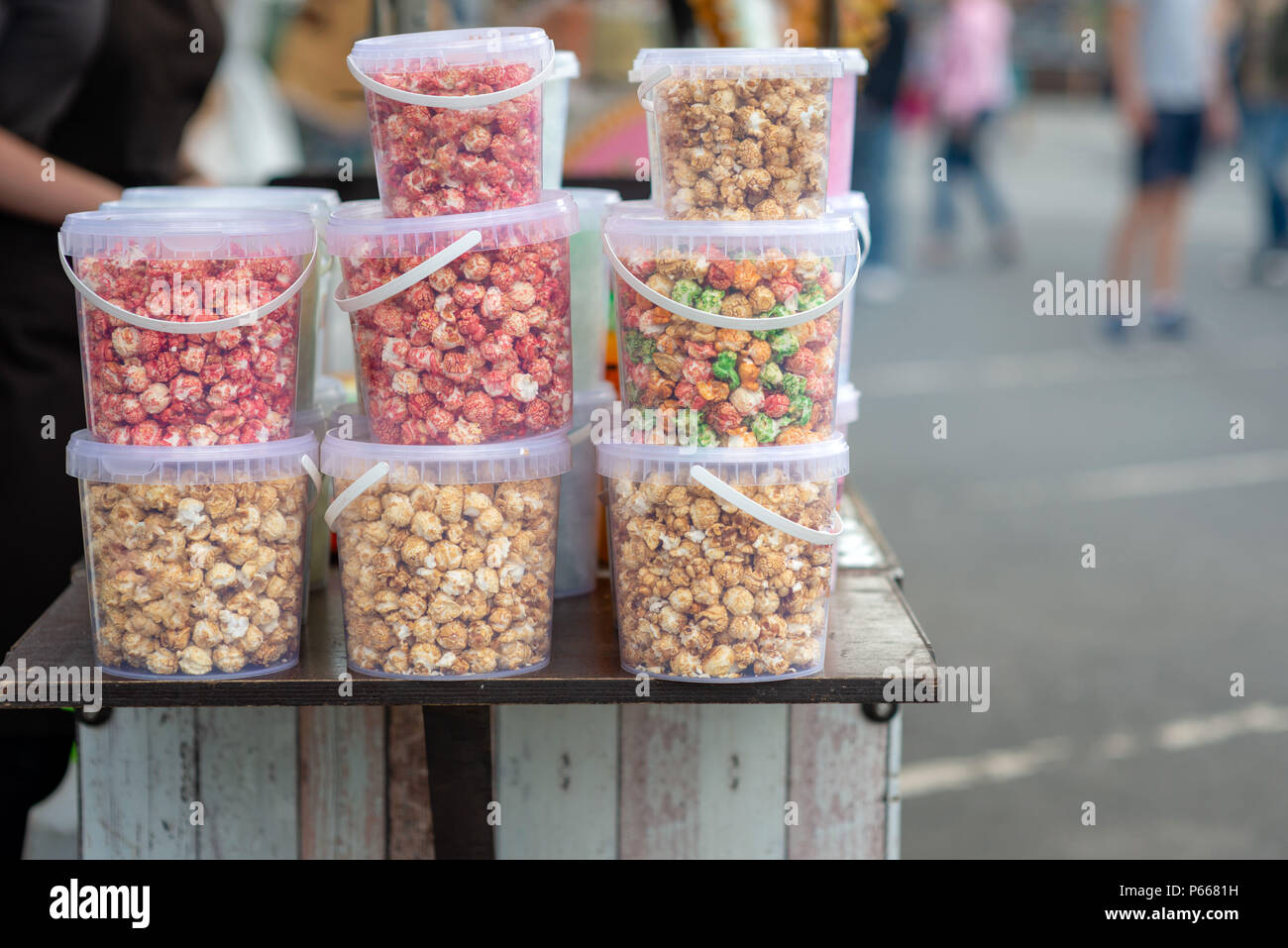 Different size buckets with colored popcorn Stock Photo - Alamy