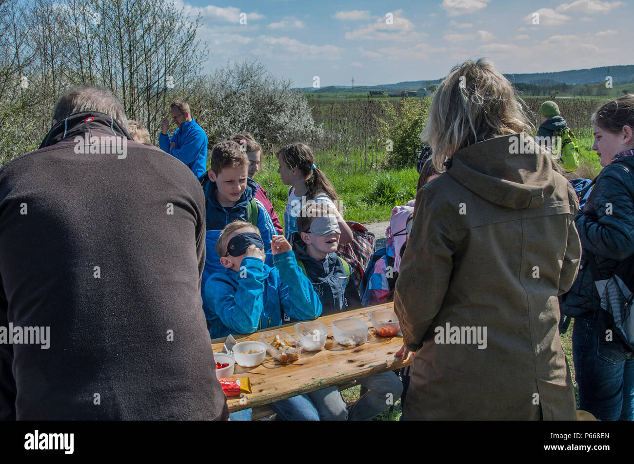 Children spend time at the “taste booth,” as they taste test organic ...