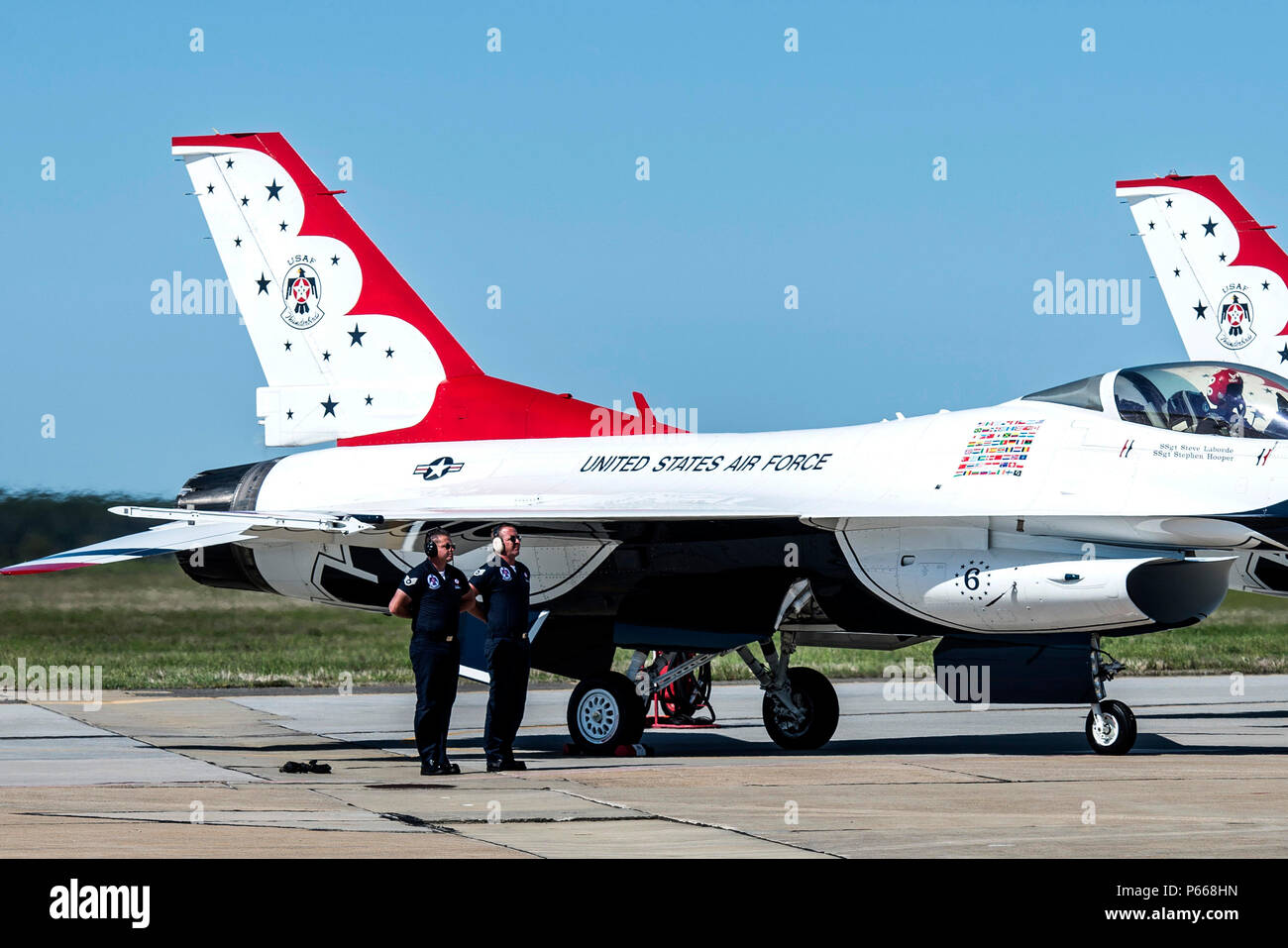 U.S. Air Force Thunderbirds team members prepare a jet for take off ...