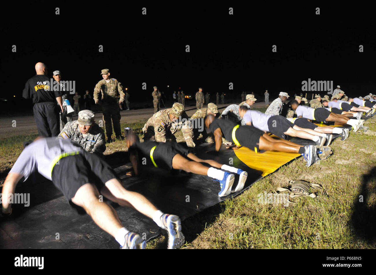Candidates perform push-ups while participating in Expert Infantryman ...