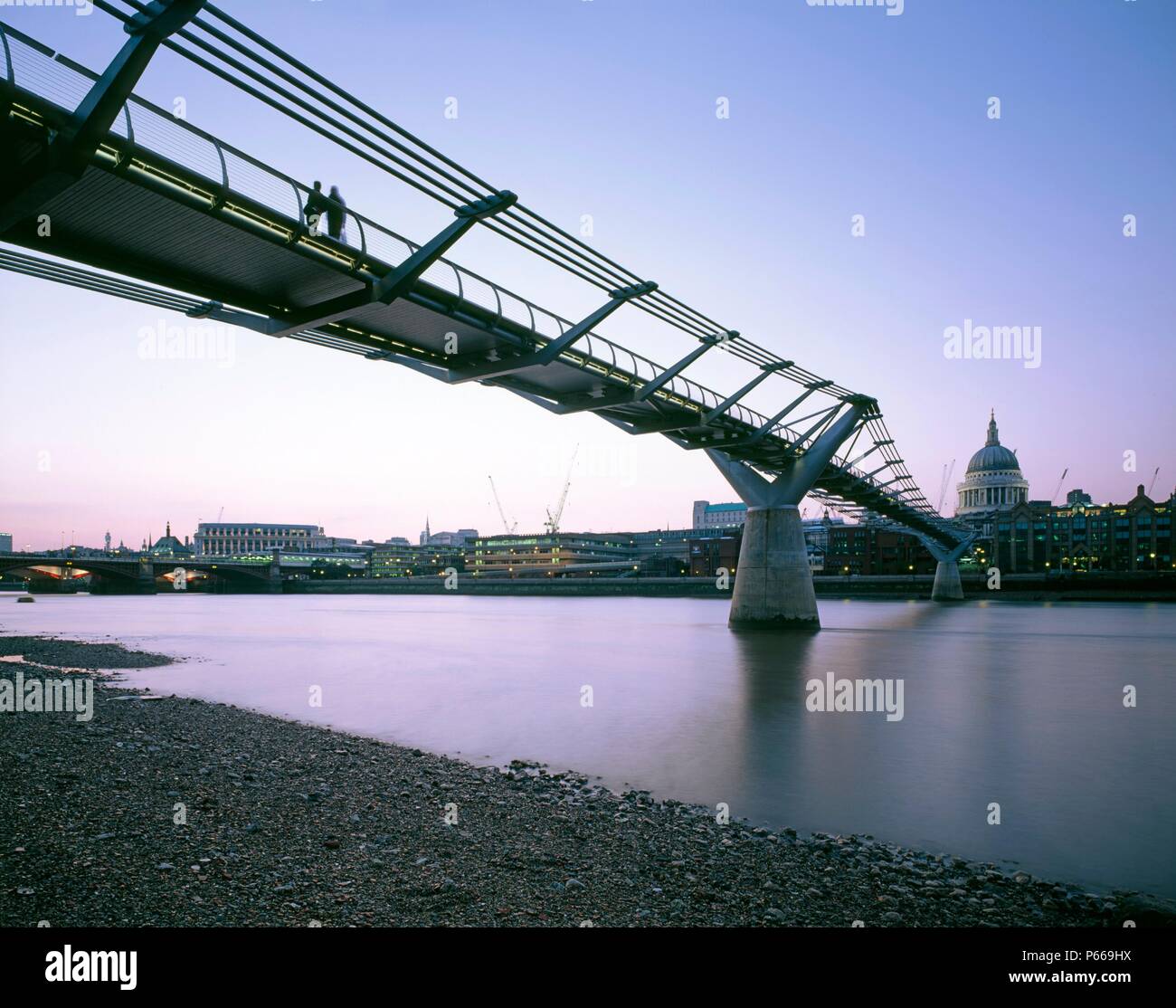 Millennium Bridge at dusk, with St Pauls Cathedral in background ...