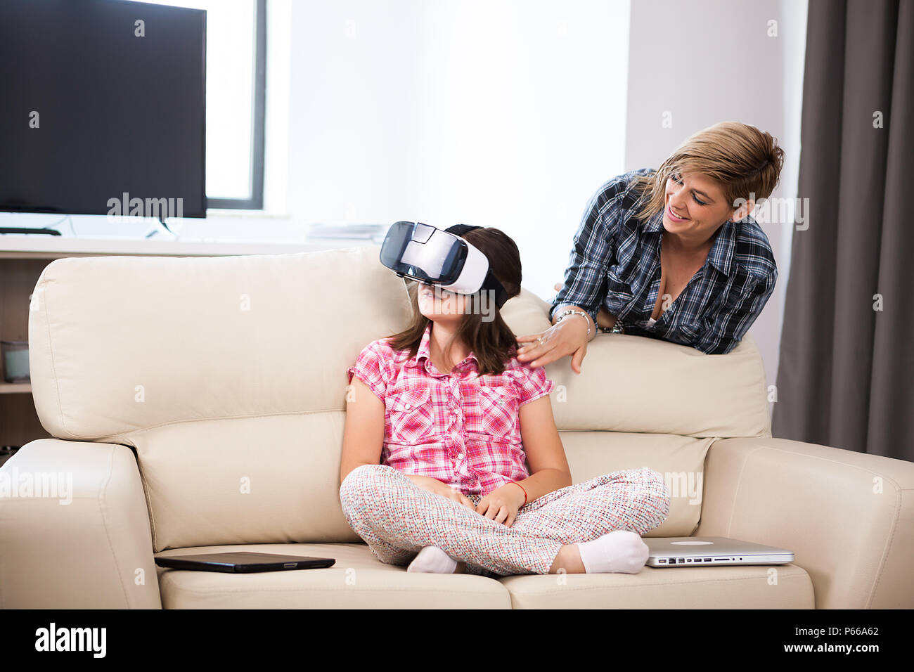 Cute little girl experiencing virtual reality with a VR headset Stock ...