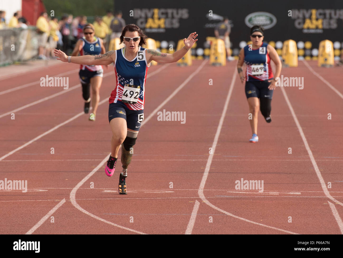U.S. Marine Corps veteran Sarah Rudder, center, takes gold in the women ...