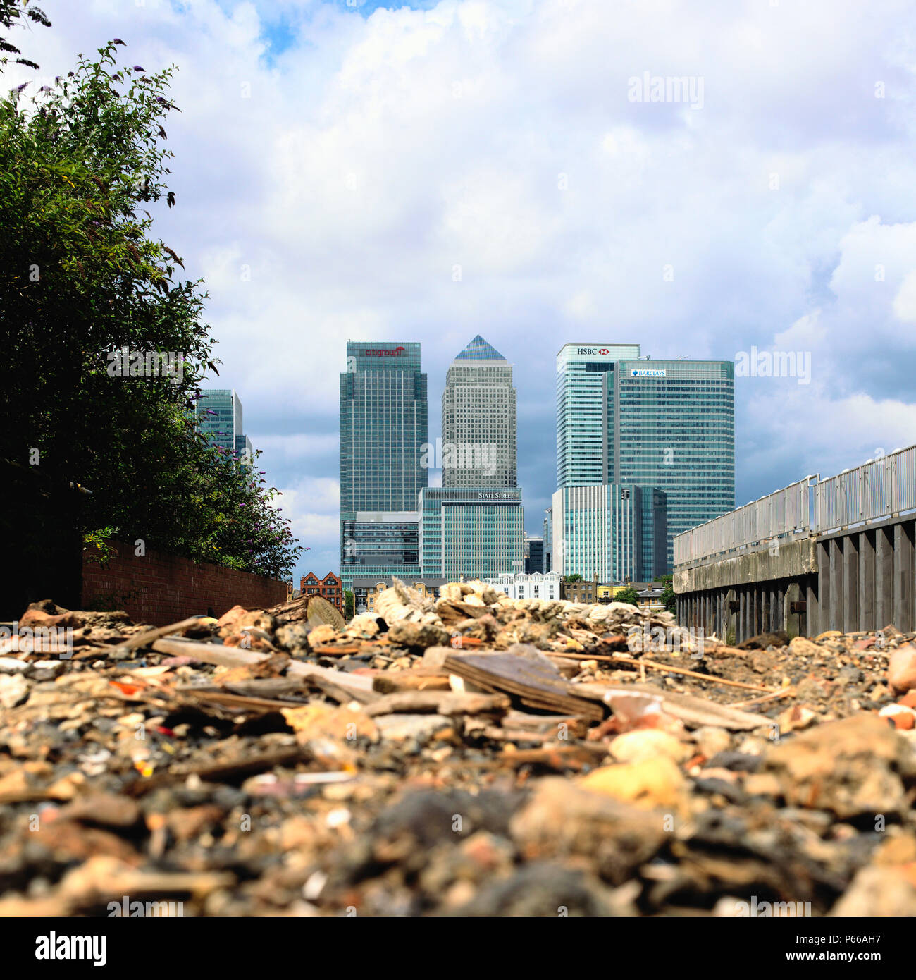 Dumped rubbish and rubble with Canary Wharf in Background, London, UK ...