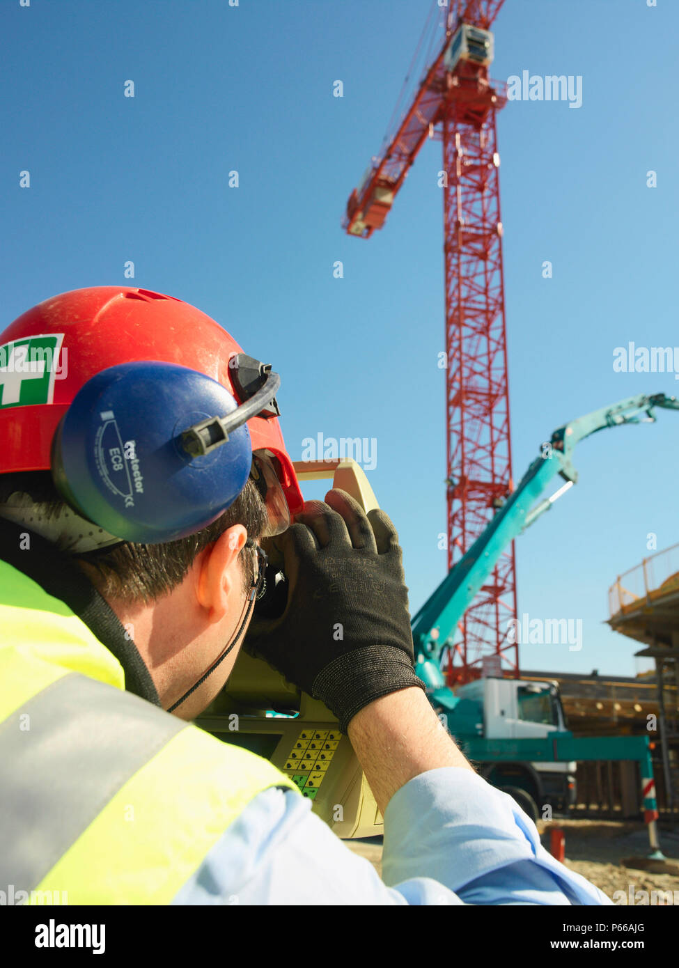 Man using theodolite, rear view Stock Photo - Alamy