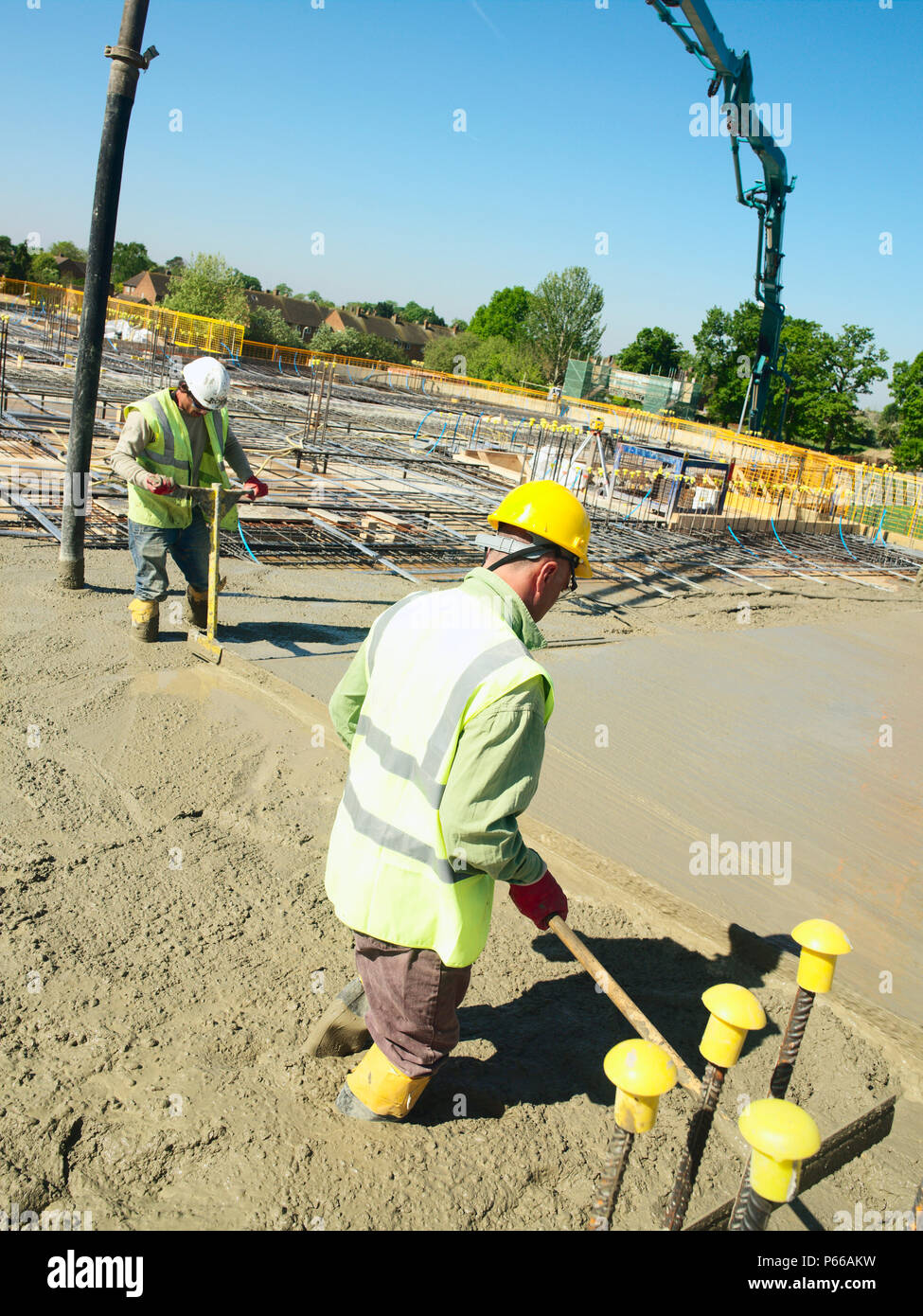Two men laying concrete hi-res stock photography and images - Alamy