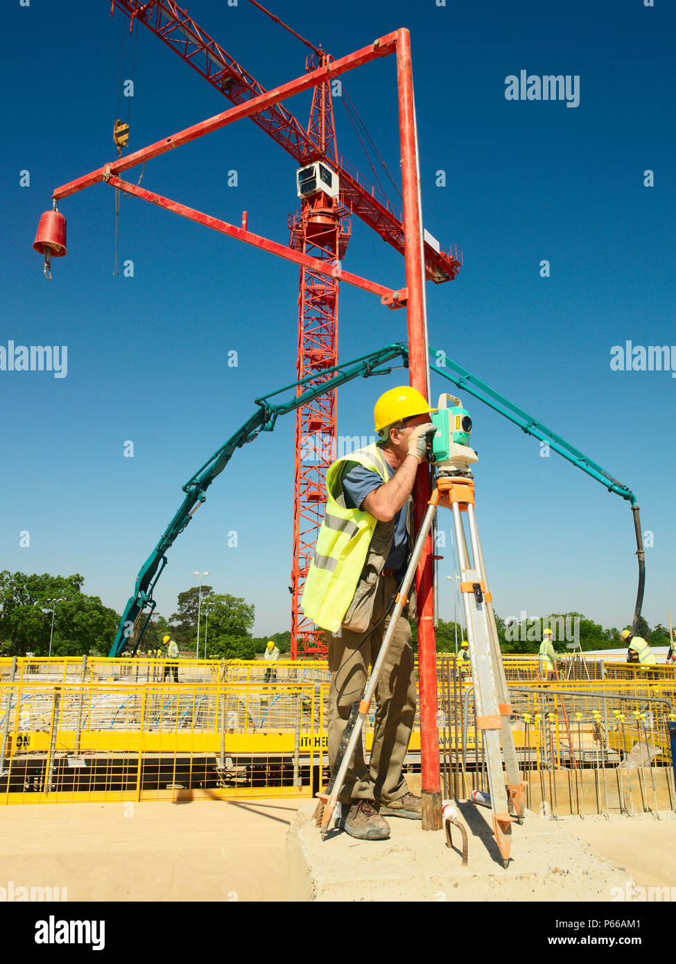 Man using theodolite on construction site Stock Photo - Alamy