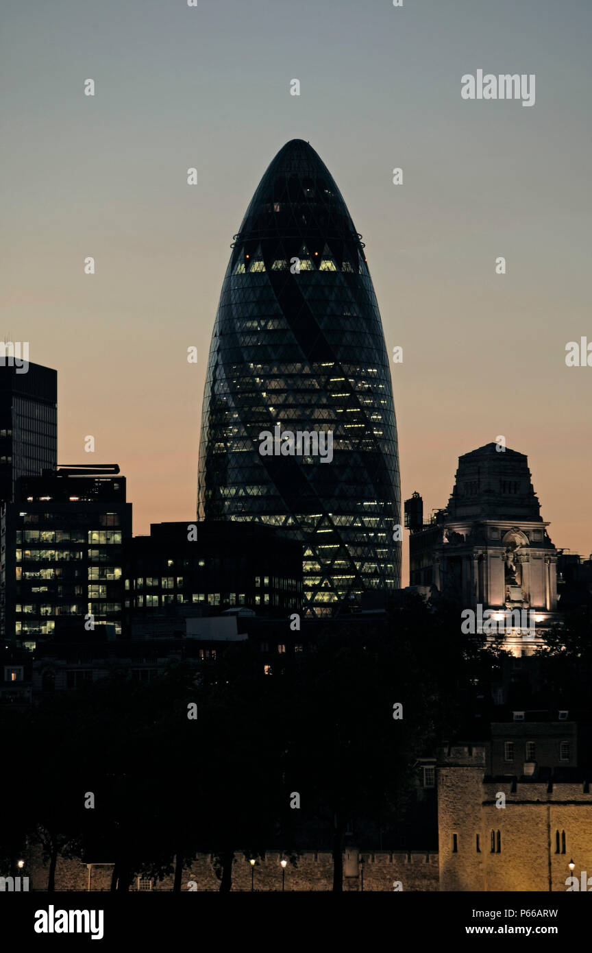 Night view of the Swiss Re building, The Gherkin, City of London ...