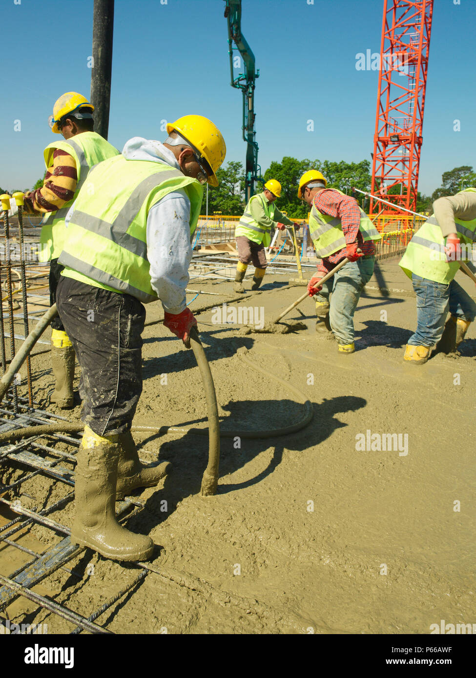 Construction workers laying down concrete Stock Photo - Alamy
