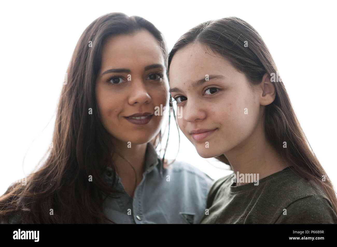 Two sisters standing near each other Stock Photo - Alamy