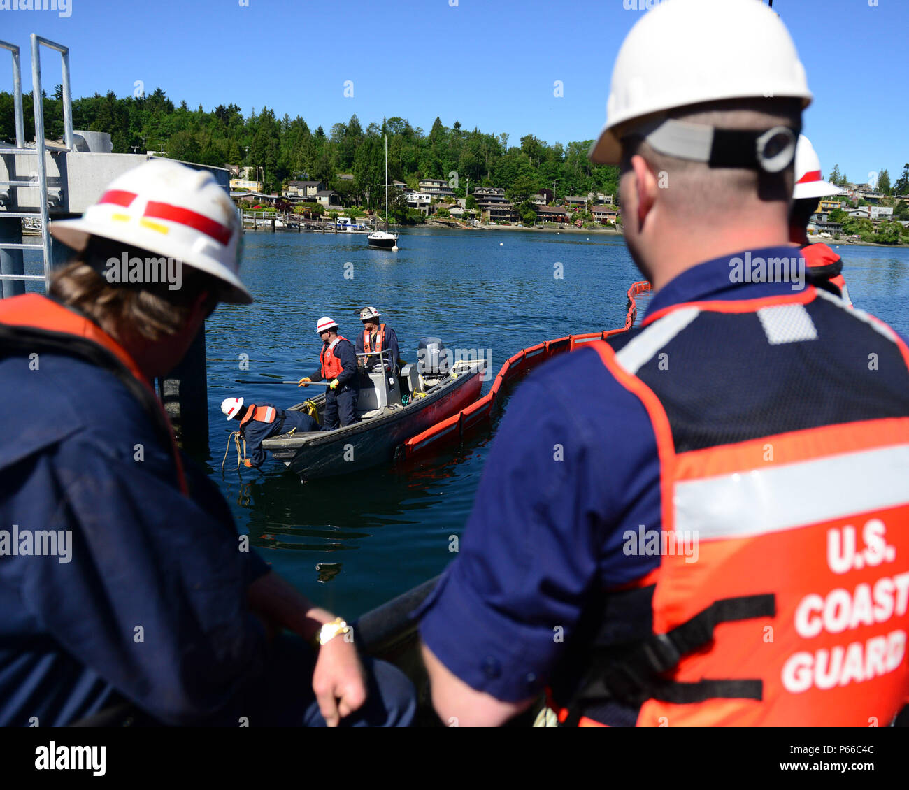 Crewmembers from the U.S. Army Corps of Engineers Marine Vessel Puget ...