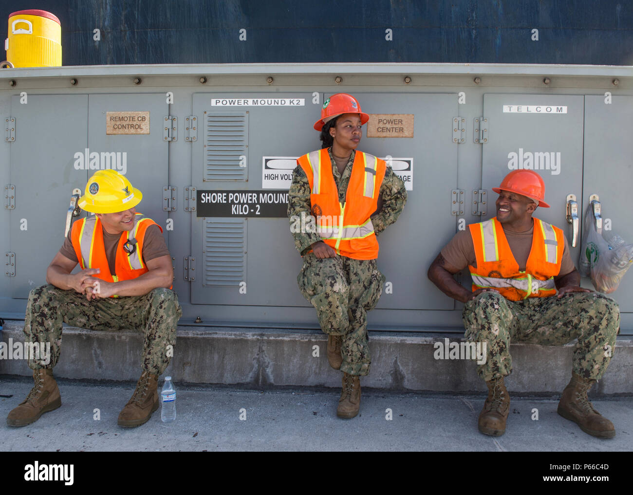 Sailors assigned to Navy Cargo Handling Battalion (NCHB) 1 rest between ...