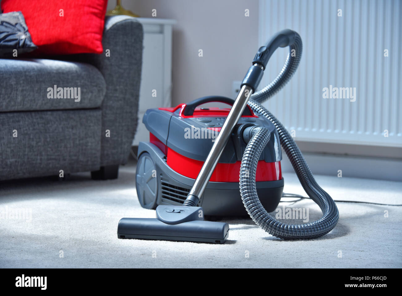 Canister vacuum cleaner for home use on the floor in the apartment ...