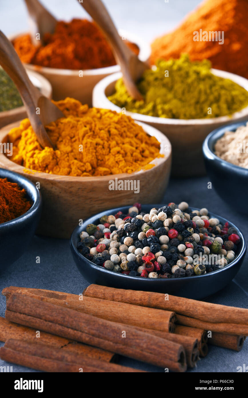 Variety of spices on kitchen table Stock Photo - Alamy