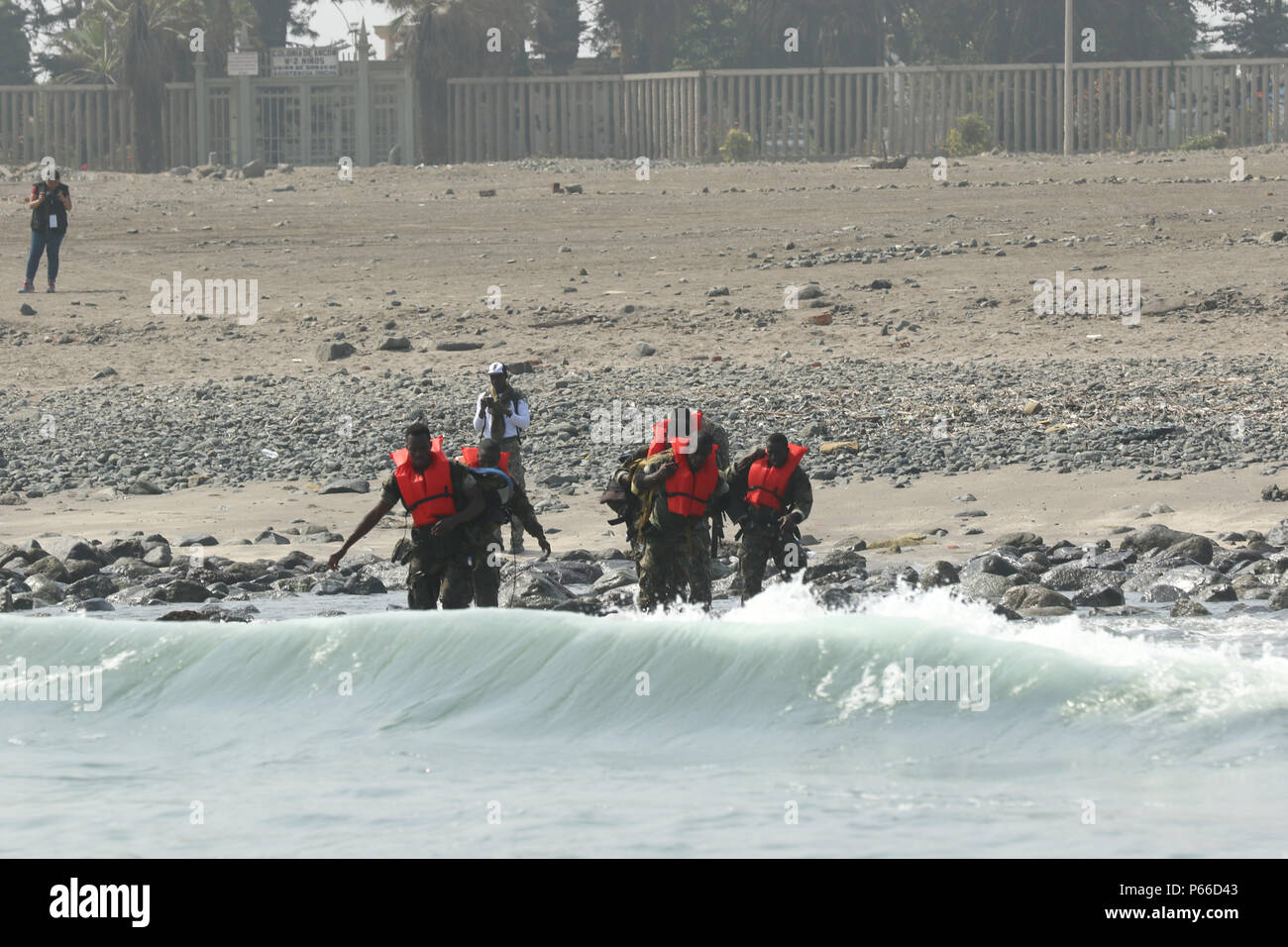 Competitors from Team Jamaica prepare to enter the Pacific Ocean with ...