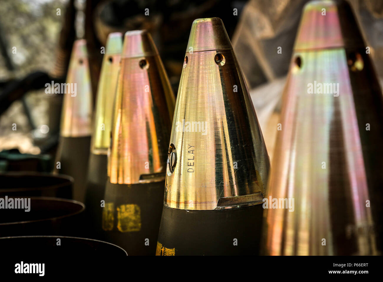 High-explosive artillery rounds are prepared to be fired during the ...