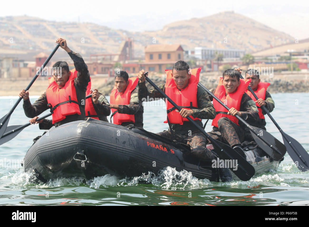 Colombian competitors paddle through ocean waves during the water event ...