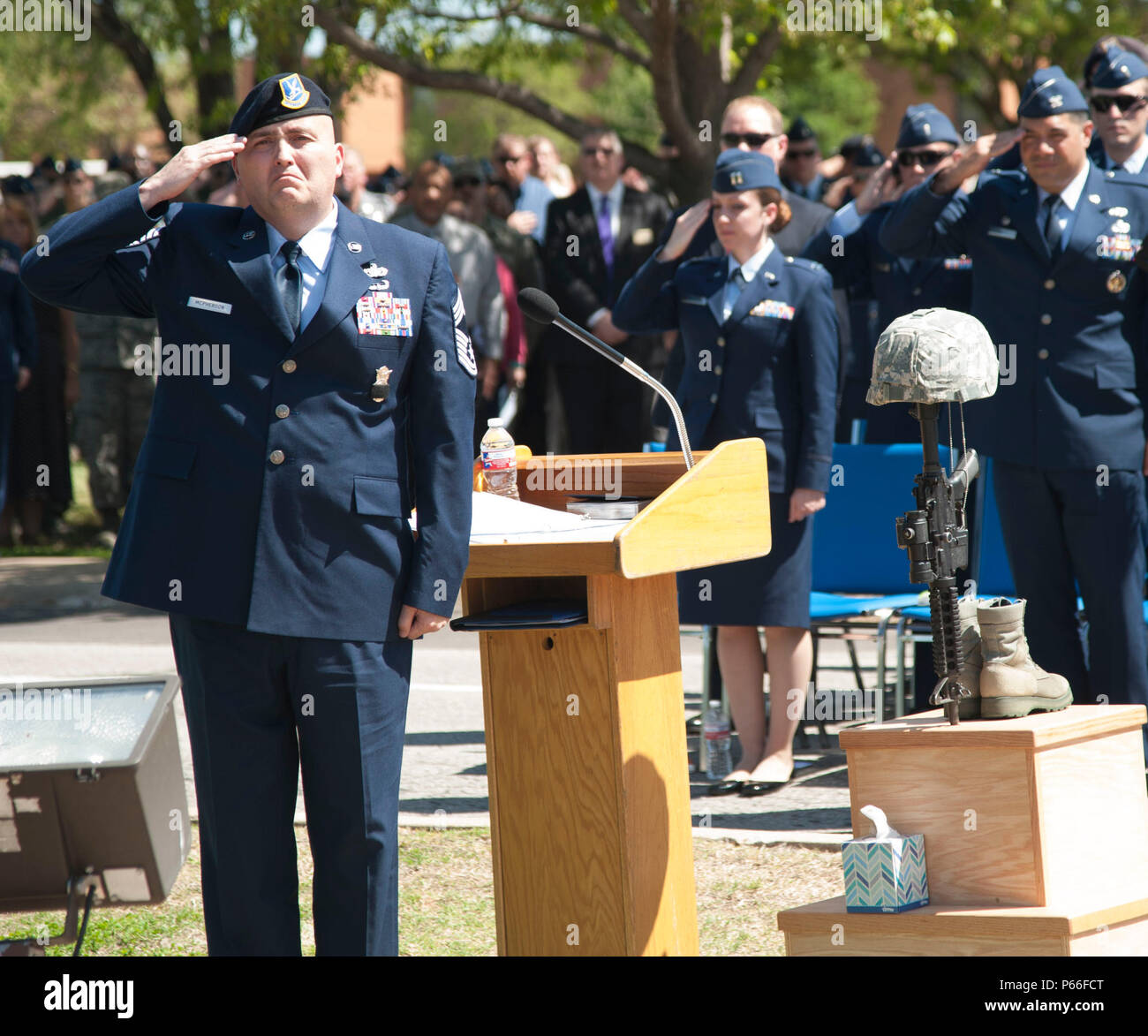 A mournful Chief Master Sgt. Bruce McPherson leads a salute at the ...