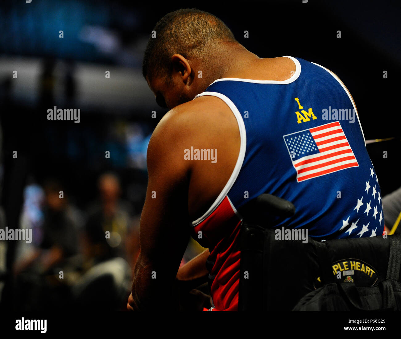 U.S. Army Sgt. Ryan Major, veteran, rest after competing in the rowing ...