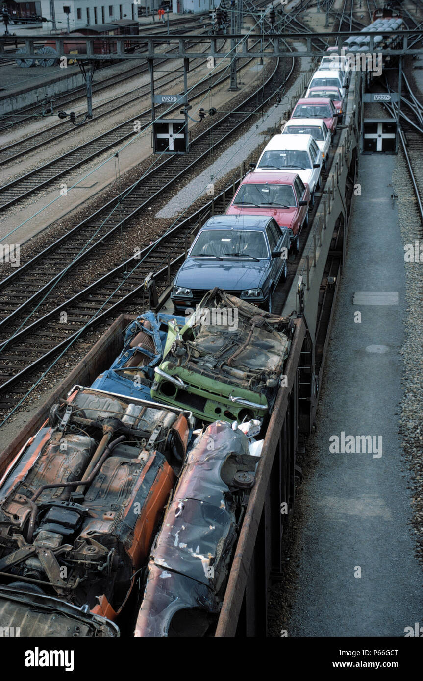 Car wrecks and secondhand cars transporting by freight train Stock ...