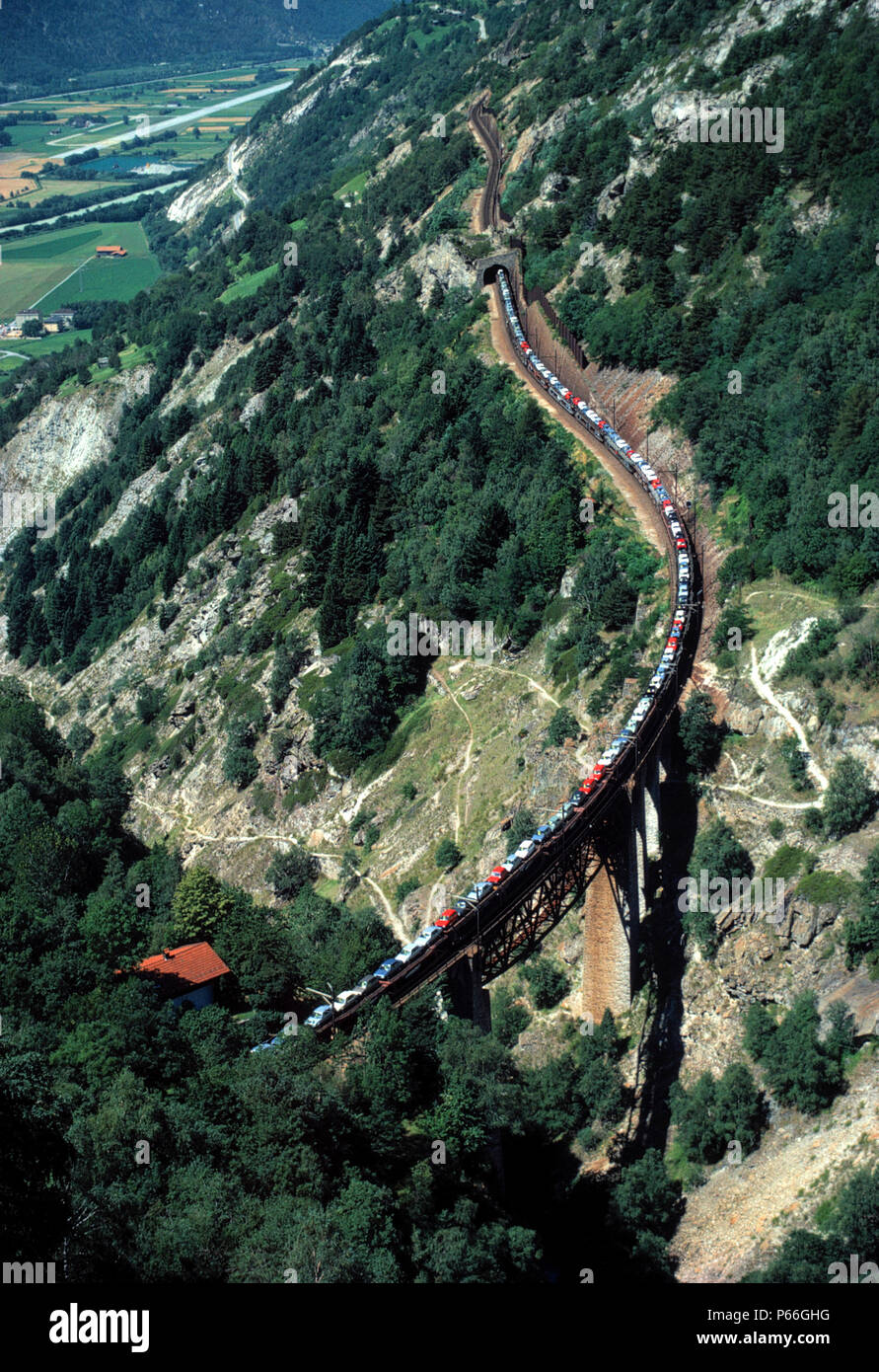 Aerial, freight train at Lotscherg railway track, Swiss Alps, Canton of ...