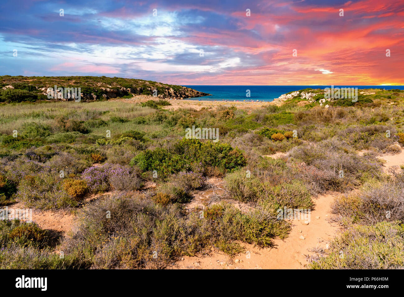 sunset on calamosche beach probably the most beautiful in Italy Stock ...