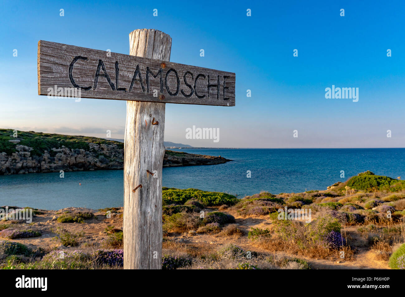 sunset on calamosche beach probably the most beautiful in Italy Stock ...