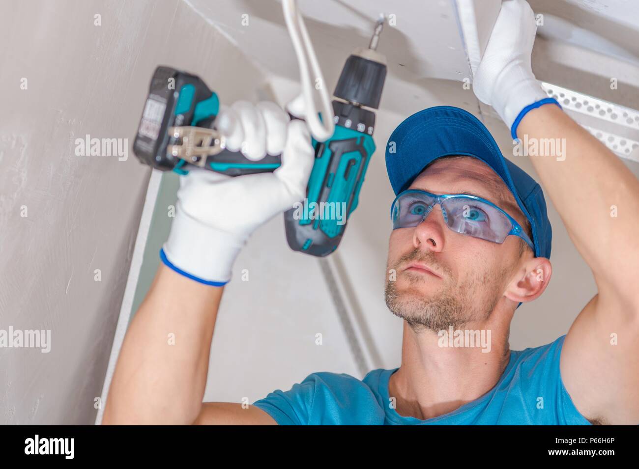 Small Remodeling Project. Caucasian Men with Power Tool Creating LED ...