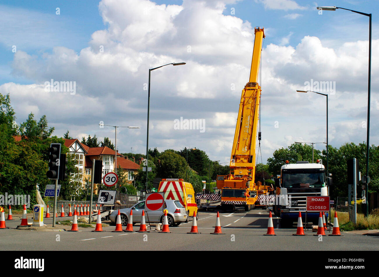 Mobile crane blocking access to road, Manchester, UK Stock Photo - Alamy