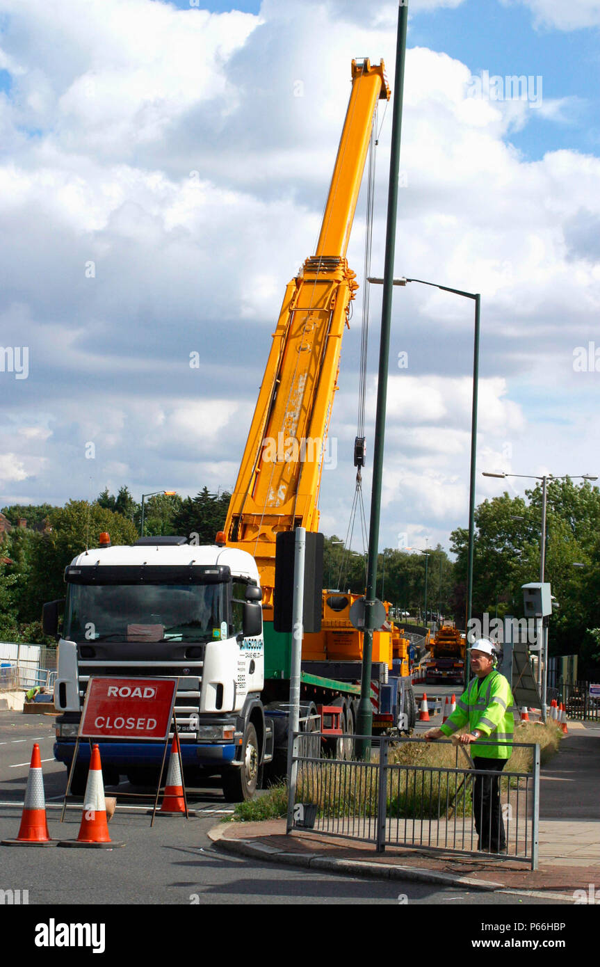 Mobile crane blocking access to road, Manchester, UK Stock Photo - Alamy