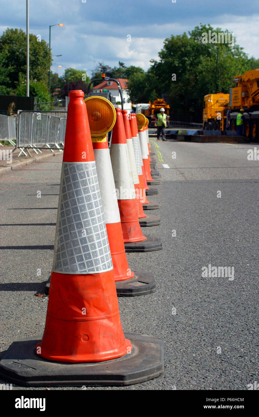 Red cones blocking access during road work Stock Photo - Alamy