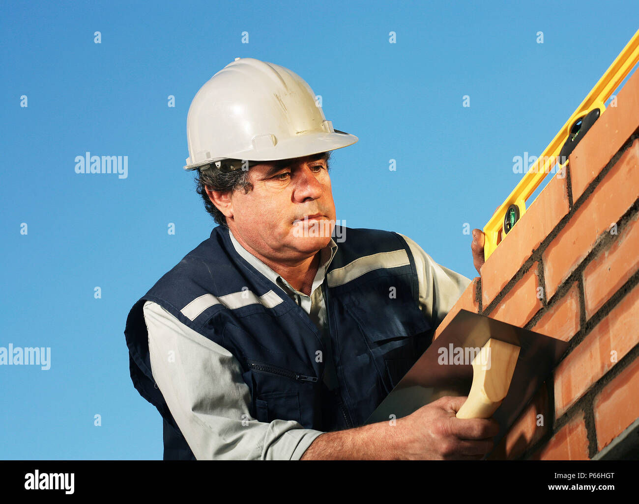 Building Worker Laying Bricks Stock Photo - Alamy