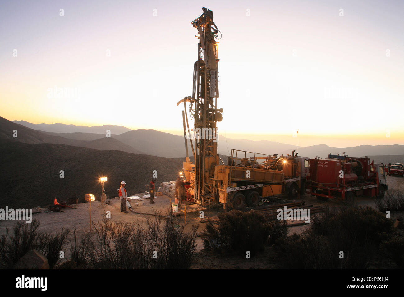 Drilling at sunset looking foto a Titanium mine Stock Photo - Alamy