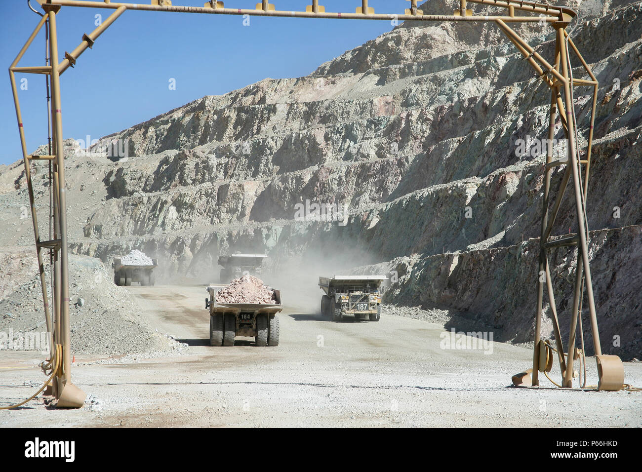 Dumper Trucks transporting ore out of copper open cast mine Escondida ...