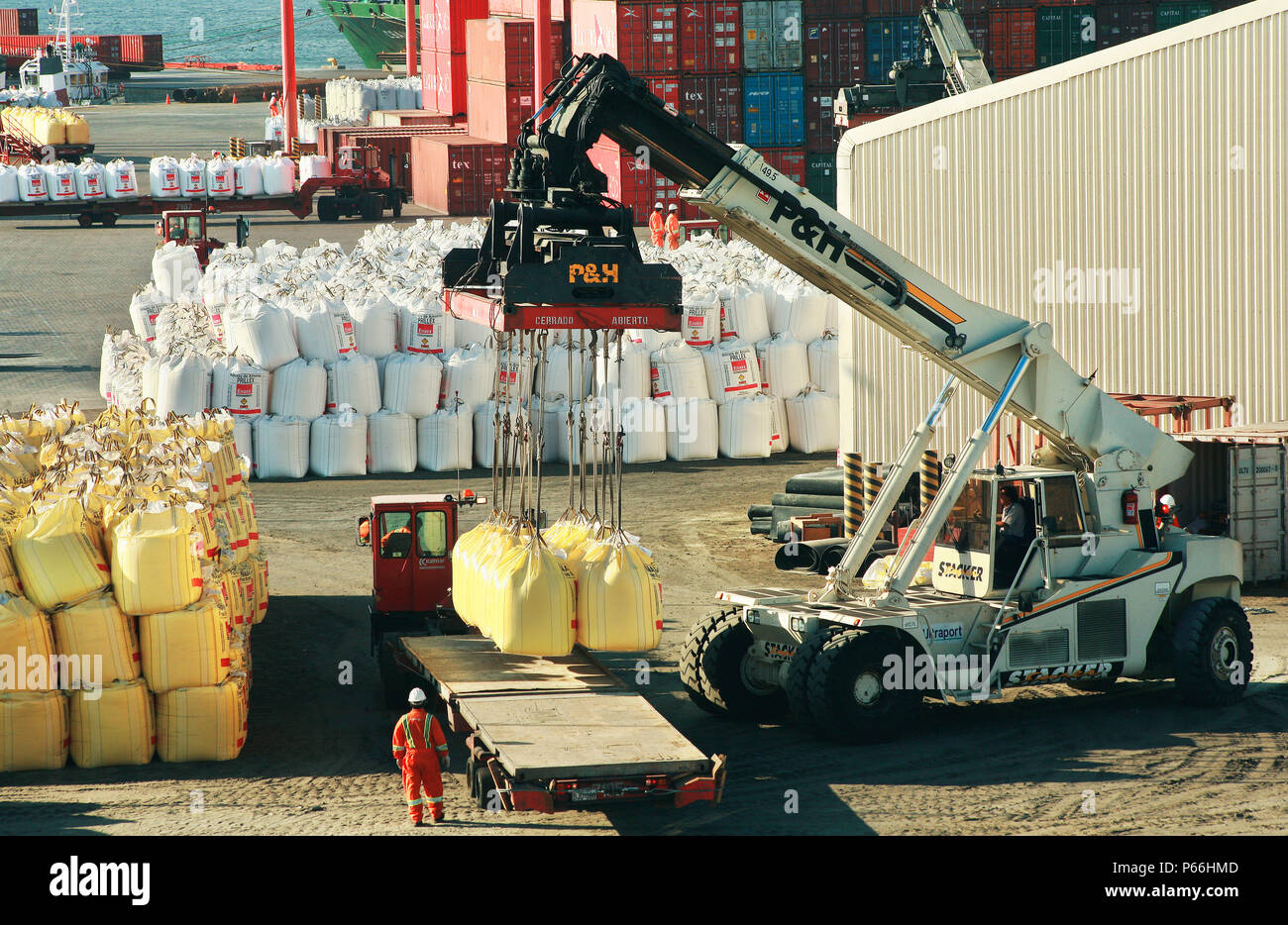 Forklift Loading Sacks Of Mineral on Truck at the port of Mejillones in ...